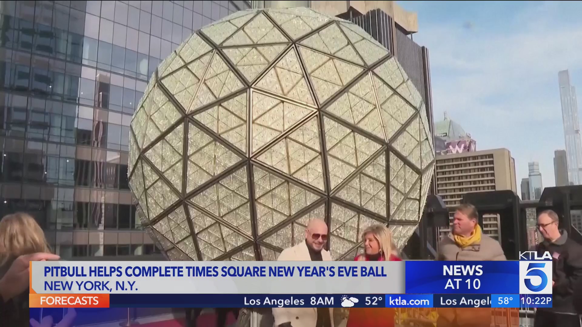 Singer Pitbull helps install final crystal triangles on Times Square ...