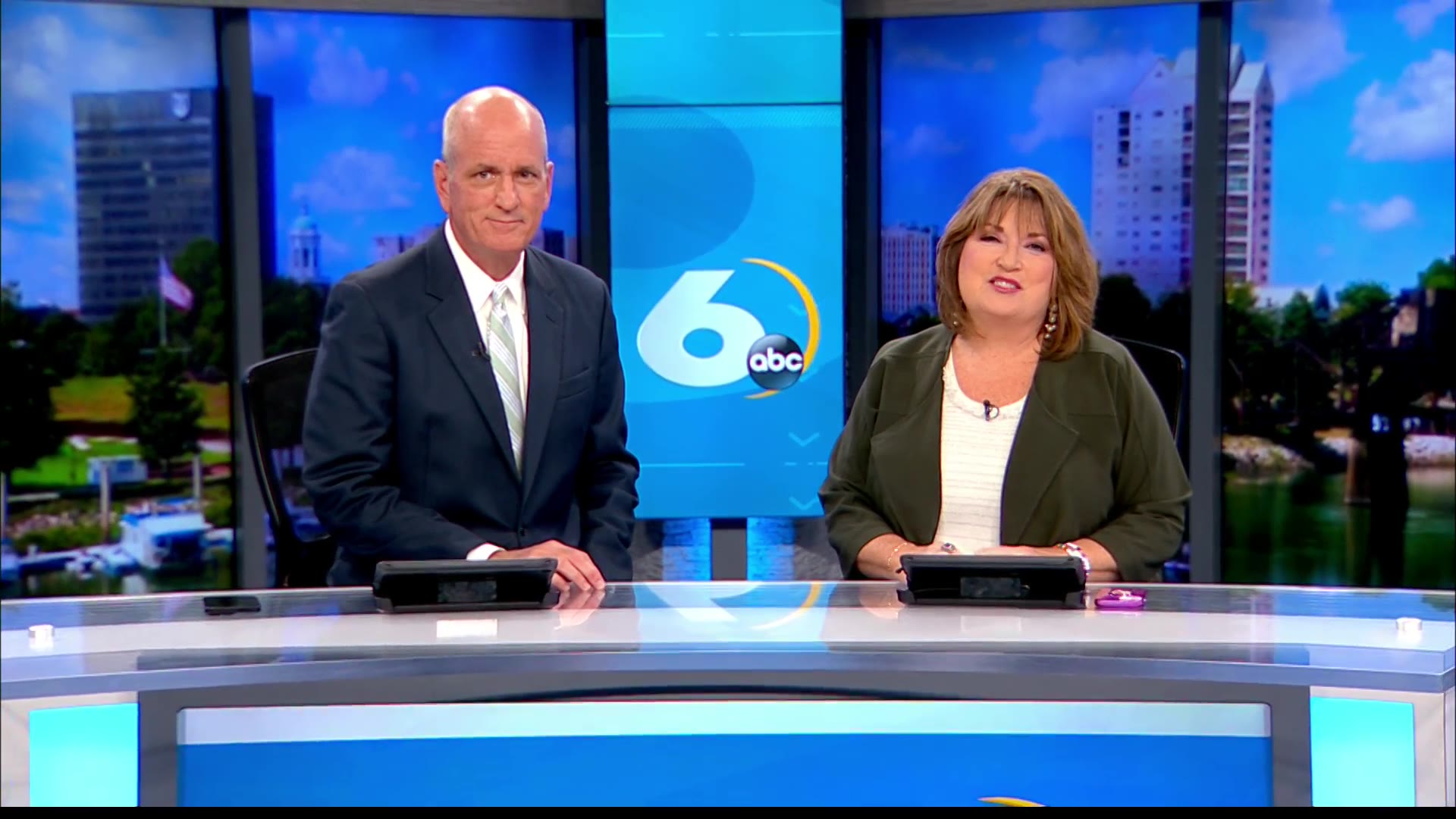 Brad and Jennie congratulate News 12 anchor Richard Rogers on ...