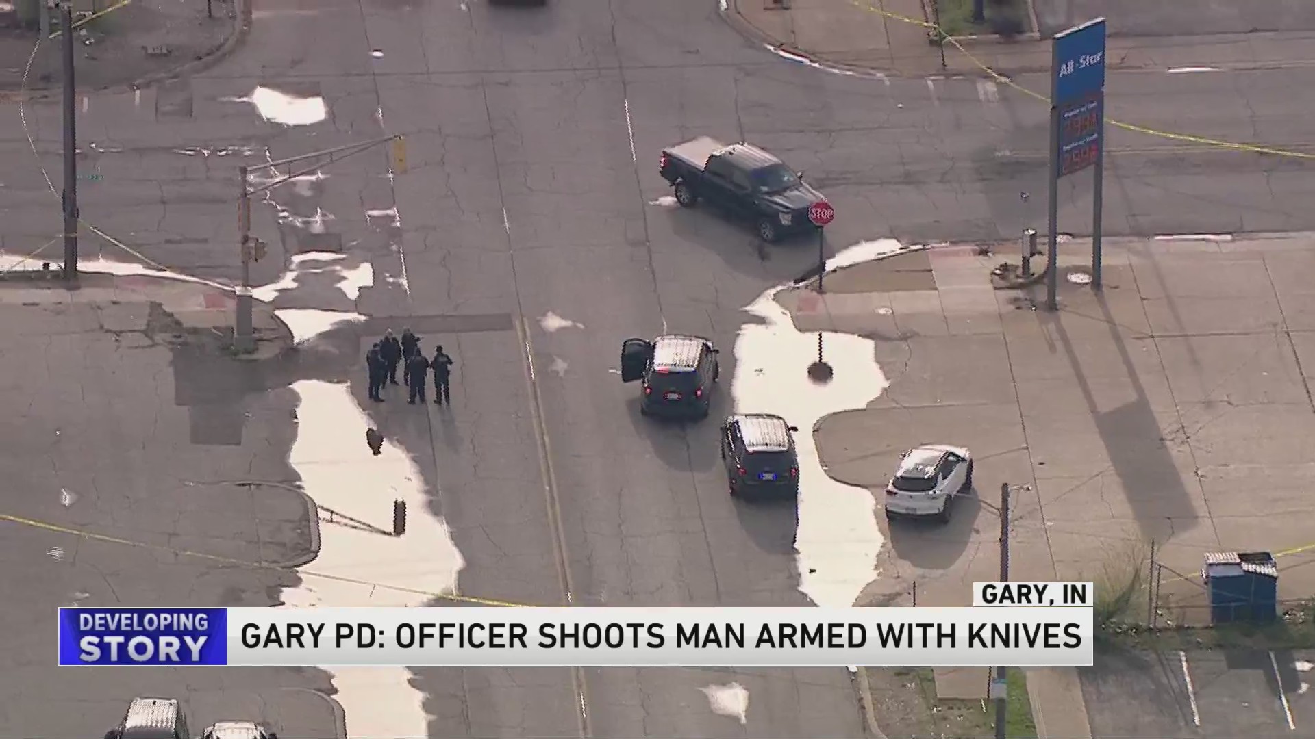 Gary police officer shoots man armed with knives – WGN-TV