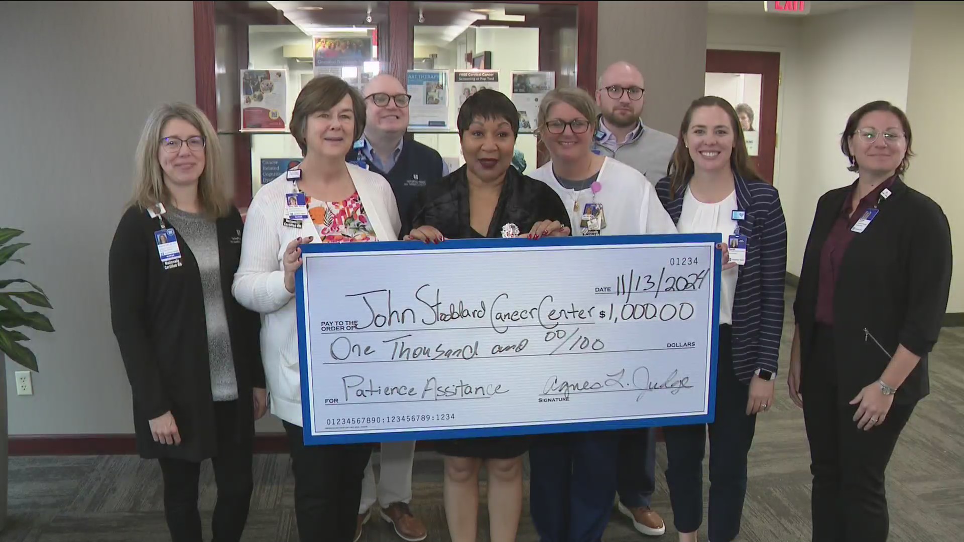 South Carolina woman, cancer survivor presents $1,000 donation to John ...