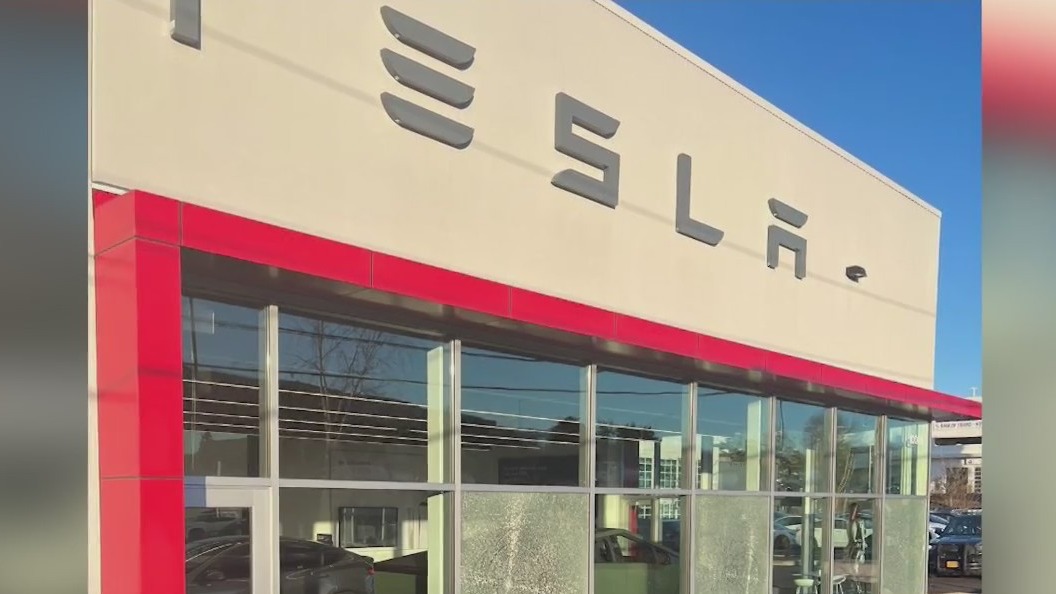 Shattered windows, bullet holes discovered at Tesla dealership in ...