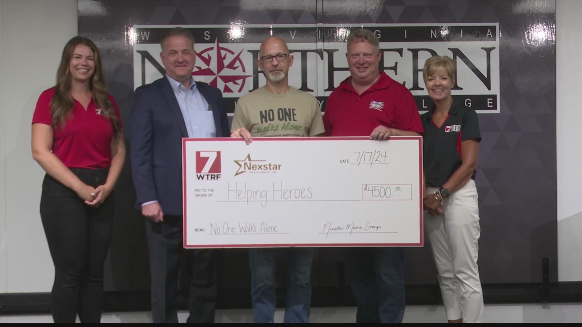 Helping Heroes presented with $4,500 check from No One Walks Alone ...