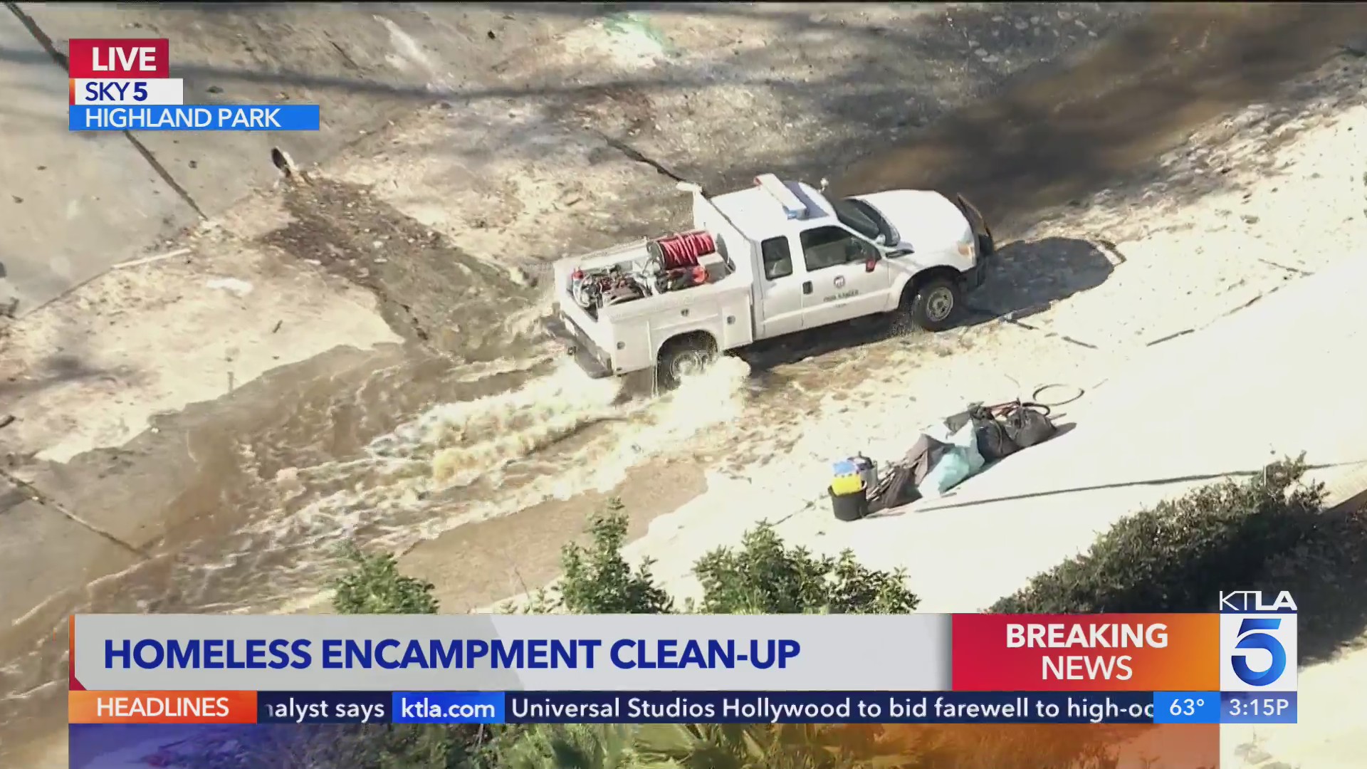 City crews take down homeless encampment in Highland Park flood channel ...