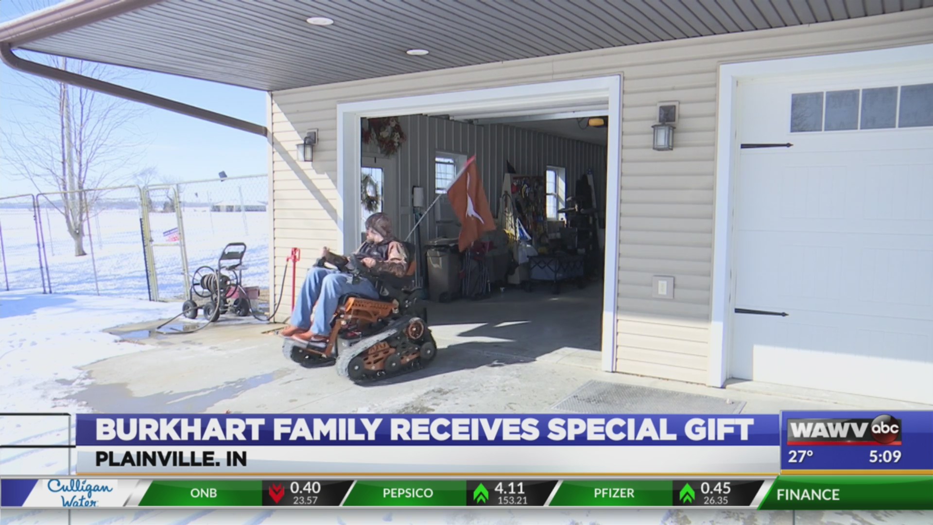 Travis Burkhart and family receive an Action Track Chair from local ...