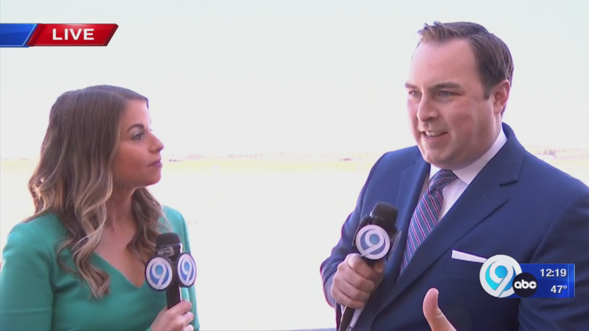 Andrew Donovana and Rachel Polansky at the airport at noon, waiting for President Biden – WSYR