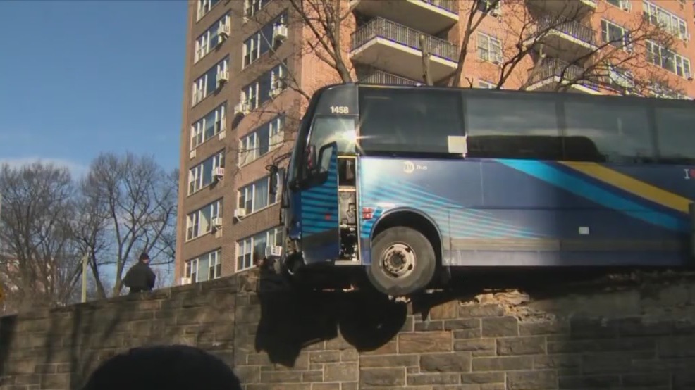 MTA bus accident in Bronx: Driver rescued from overhanging wheel – PIX11