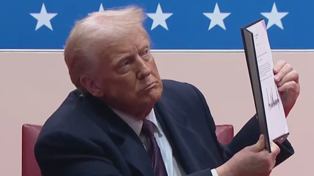 President Donald Trump signs executive orders at Capitol One Arena ...