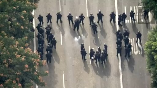 Police in riot gear march Dodgers parade route as fans get unruly – KTLA