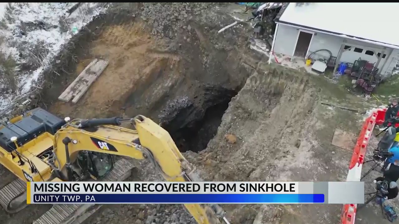 Crews recover the body of a woman from a Pennsylvania sinkhole after a ...