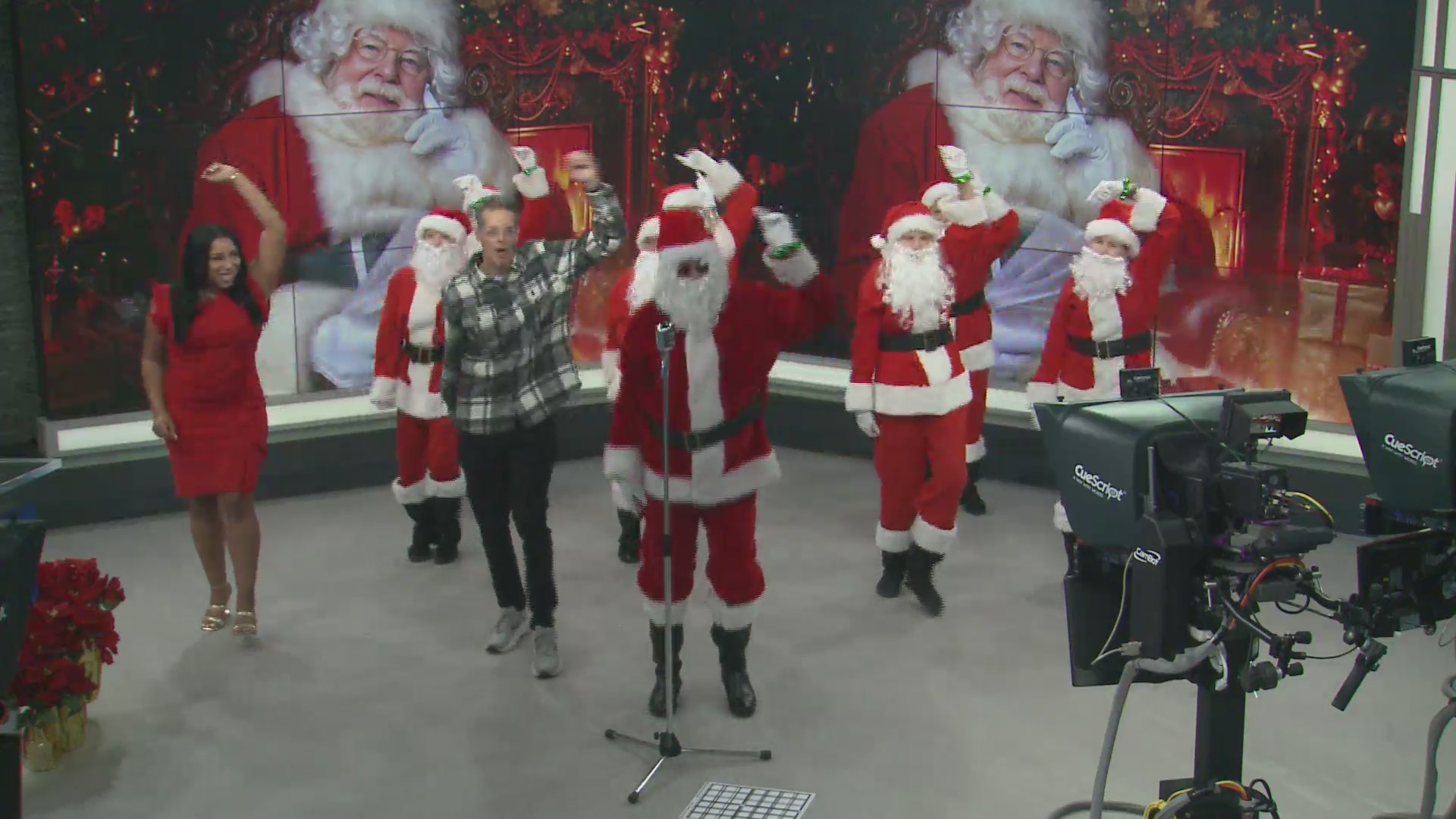 Dancing Santas perform with FOX 2 Anchors – FOX 2
